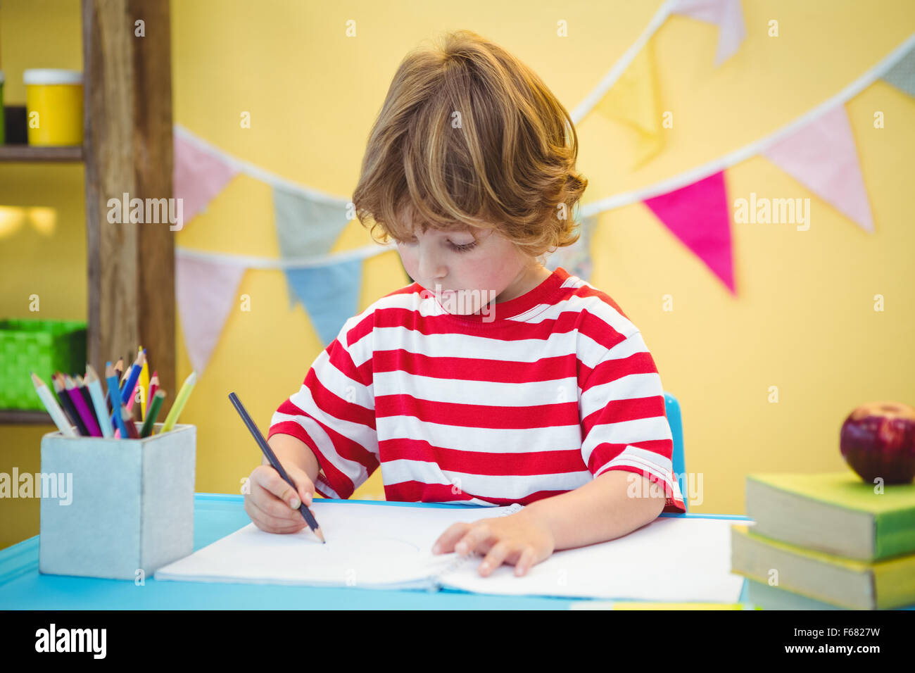 Child using pencil hi-res stock photography and images - Alamy