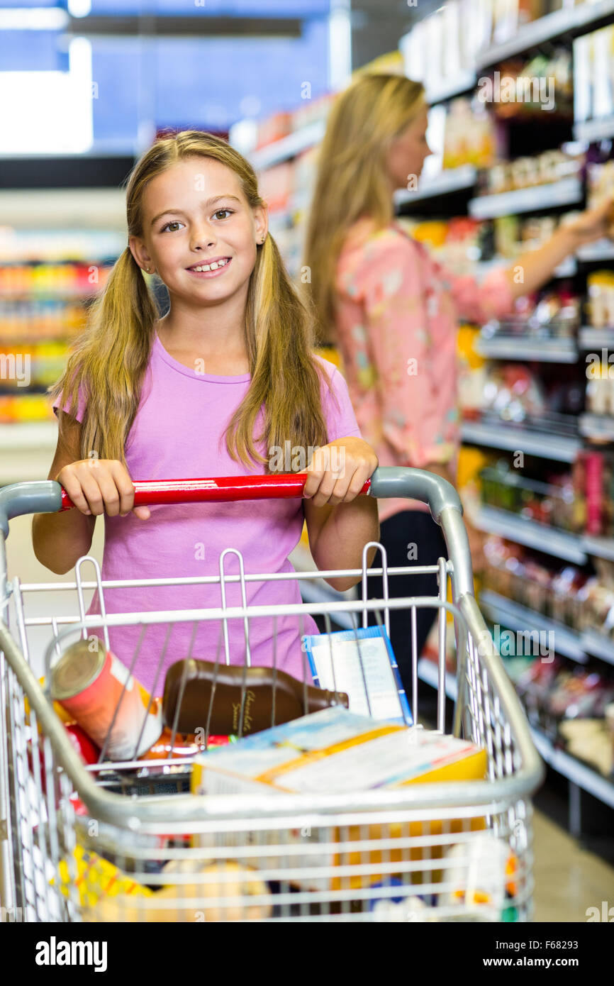 Smiling child at the supermarket Stock Photo - Alamy