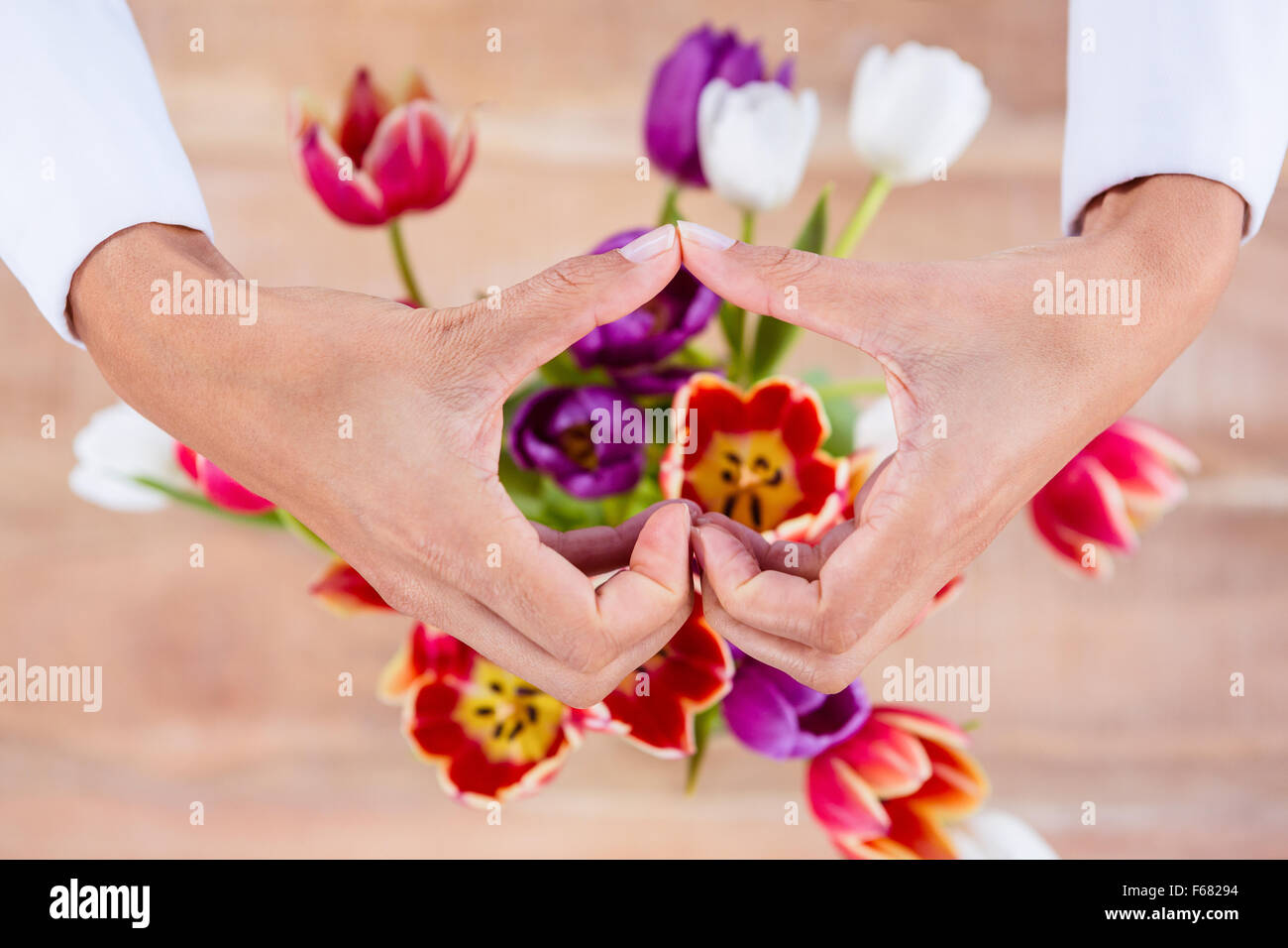 View of hands making heart shape Stock Photo - Alamy