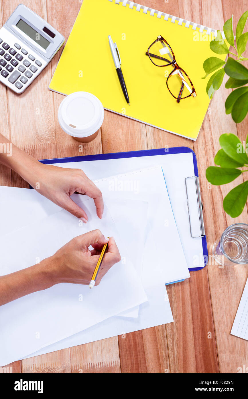 Part of hands taking notes Stock Photo - Alamy