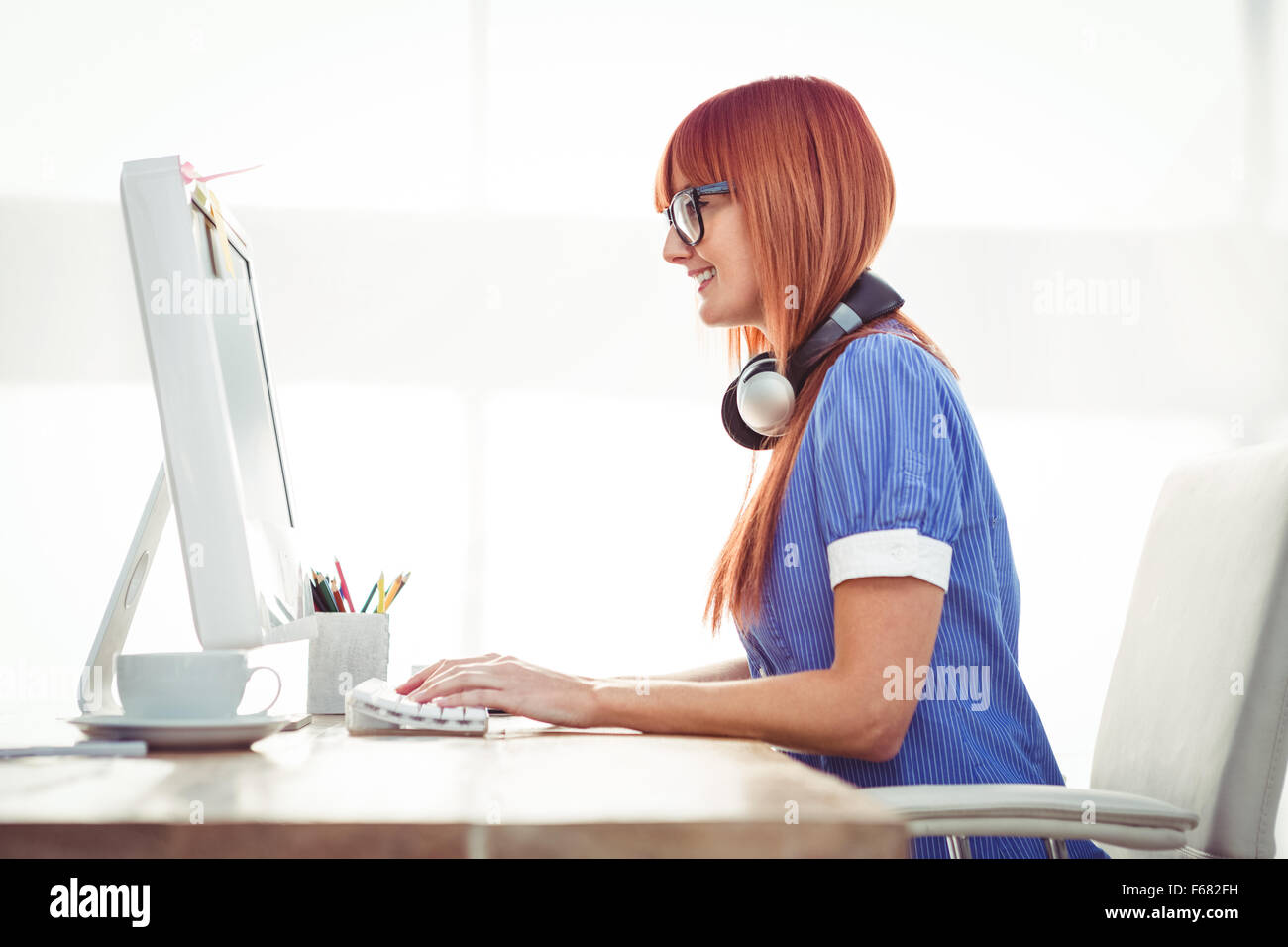 Woman headphones computer keyboard hi-res stock photography and images ...