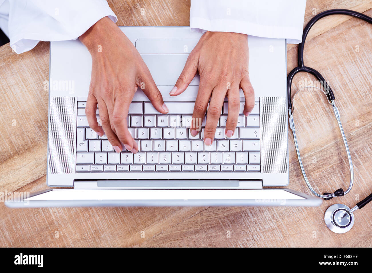 Doctor typing notes hi-res stock photography and images - Alamy