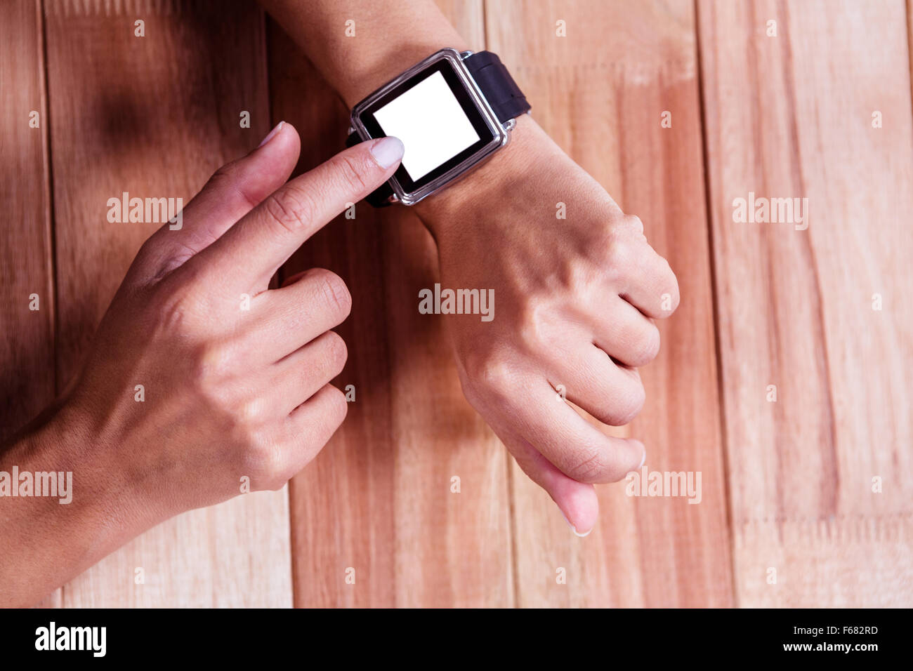 Part of hands typing on a watch Stock Photo - Alamy