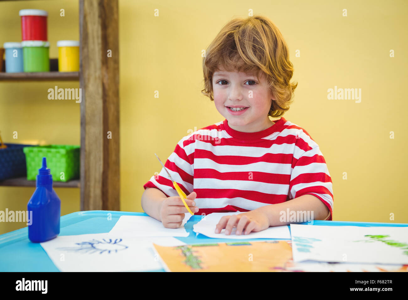 Boy Using Scissors To Cut Paper Stock Photo Alamy boy-using-scissors-to-cut-paper-stock-photo-alamy