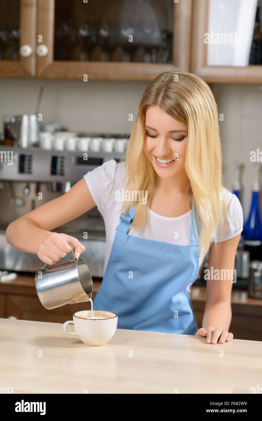 Woman standing café counter hi-res stock photography and images - Alamy