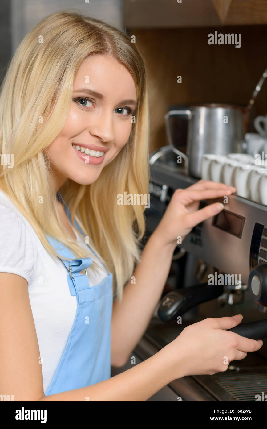 Nice waitress making coffee Stock Photo - Alamy