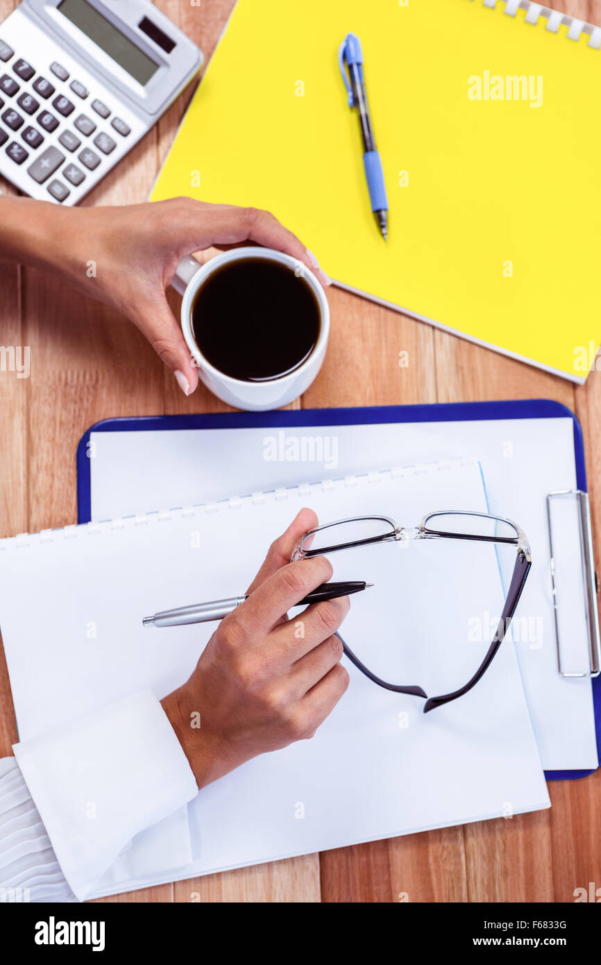 Part of hands taking notes Stock Photo - Alamy