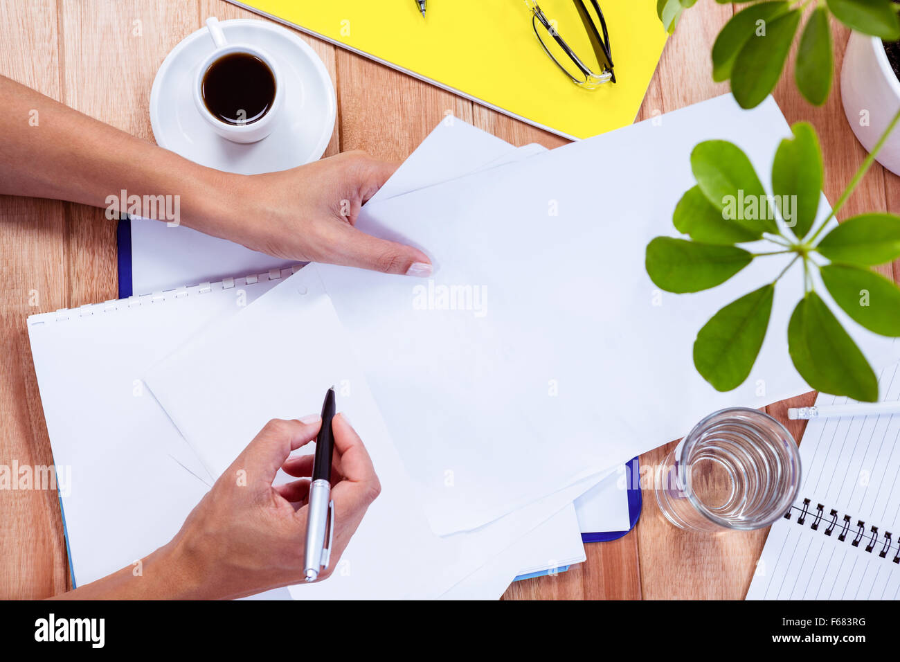 Part of hands taking notes Stock Photo - Alamy