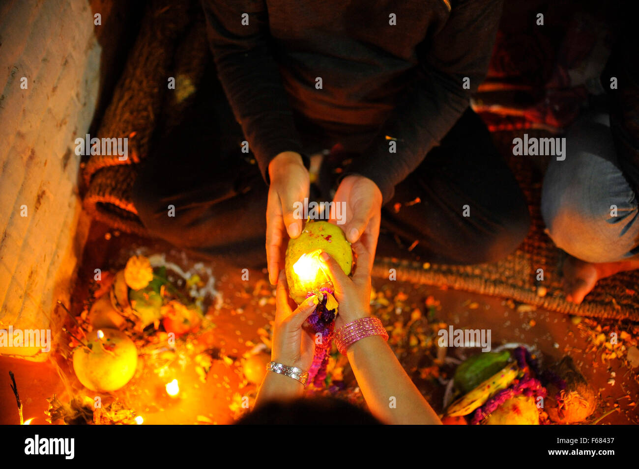 Kathmandu, Nepal. 13th Nov, 2015. A Brother receives fruits from her ...