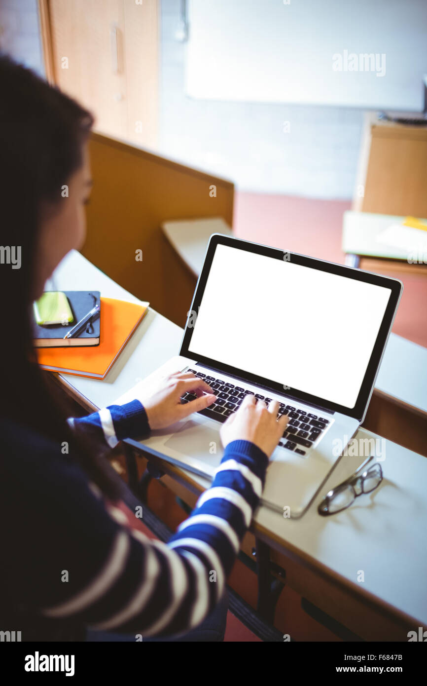 Happy student in lecture hall using laptop Stock Photo - Alamy