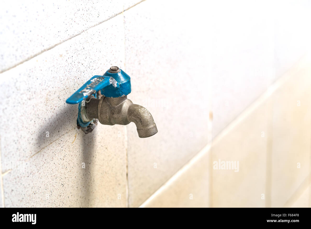 old faucet on concrete wall, save the water concept Stock Photo - Alamy