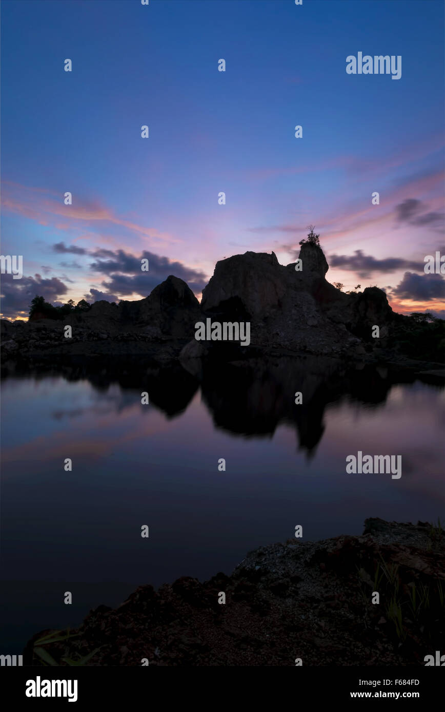 Rock mountain cliff over twilight background Stock Photo - Alamy