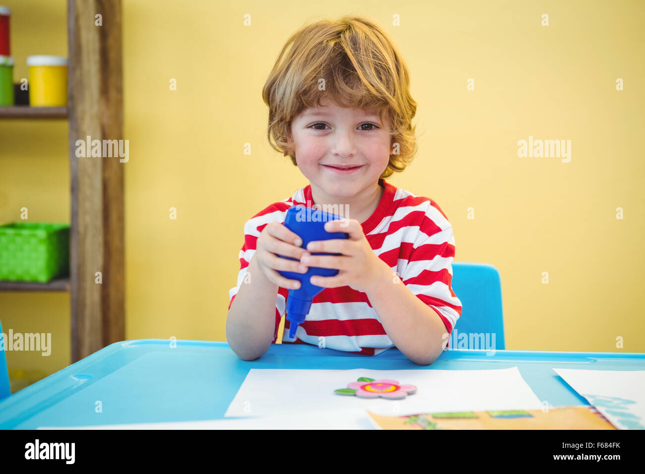 Child using glue hi-res stock photography and images - Alamy