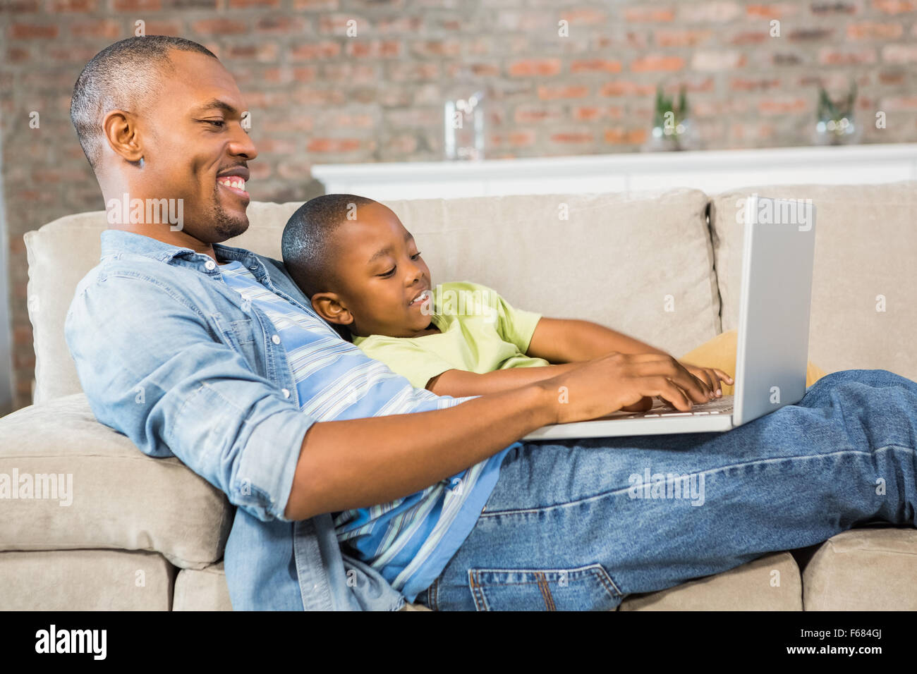 Father son laptop computer on hi-res stock photography and images - Alamy