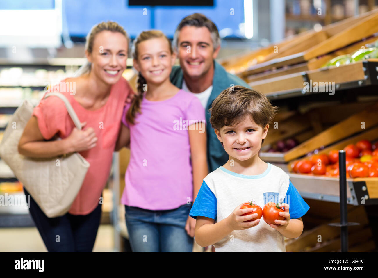 Young family doing some shopping Stock Photo - Alamy