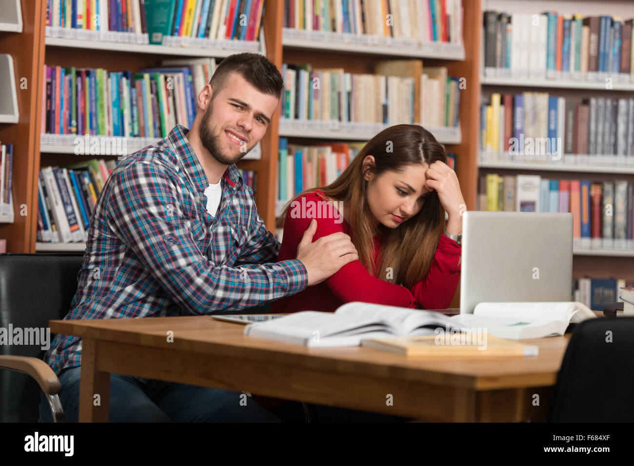 Stressed Students In High School Sitting At The Library Desk - Shallow ...