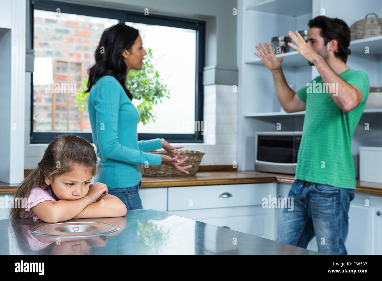 Sad child listening to parents argument Stock Photo - Alamy