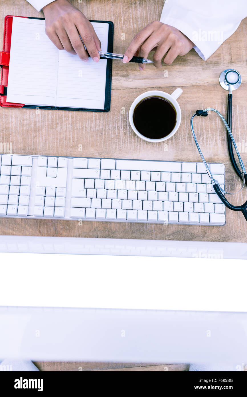 Doctor writing on diary hi-res stock photography and images - Alamy