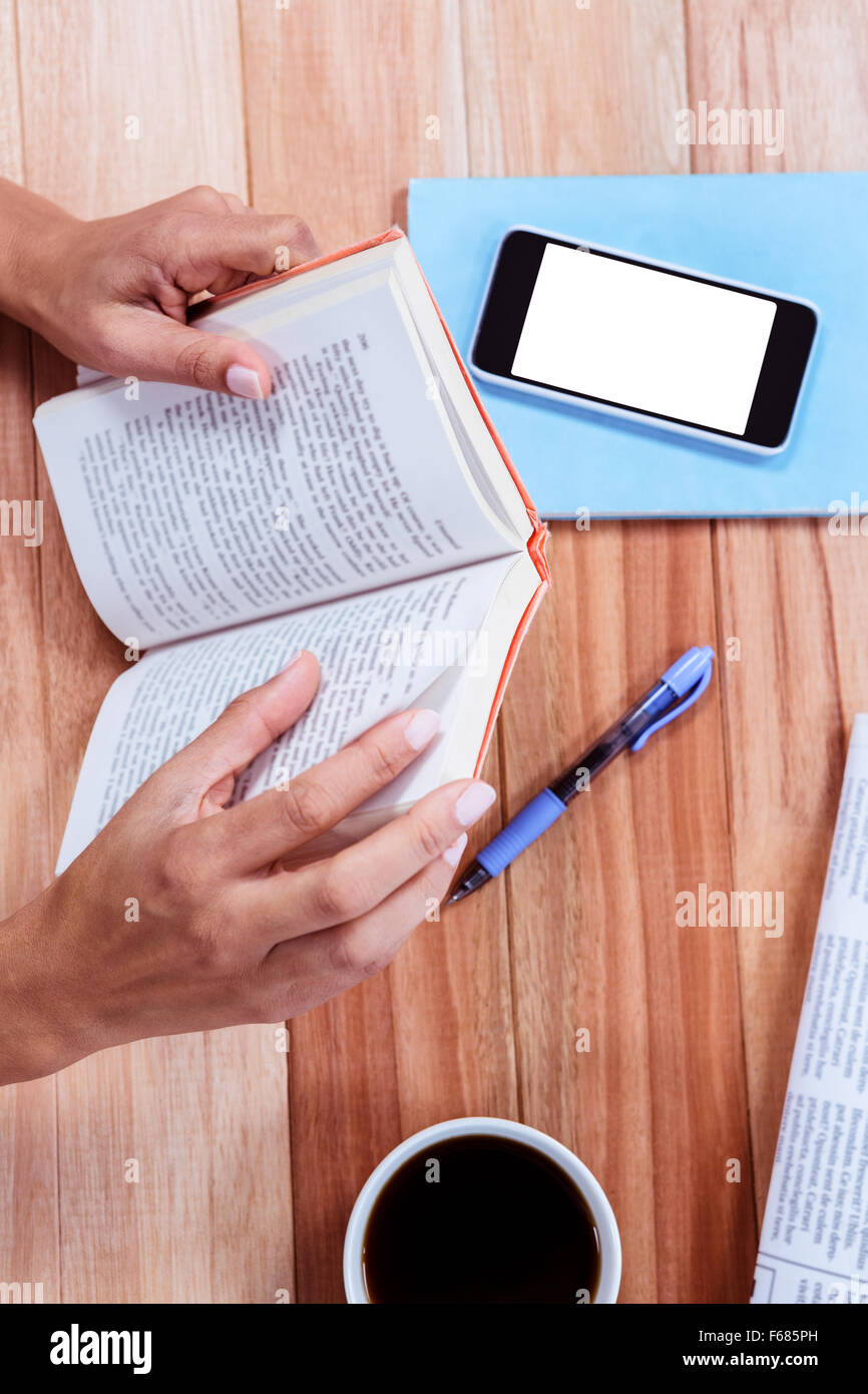 Hands holding book hi-res stock photography and images - Alamy
