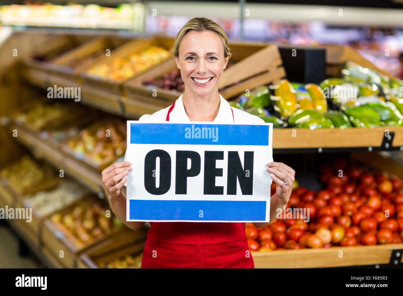Woman holding sign hi-res stock photography and images - Alamy