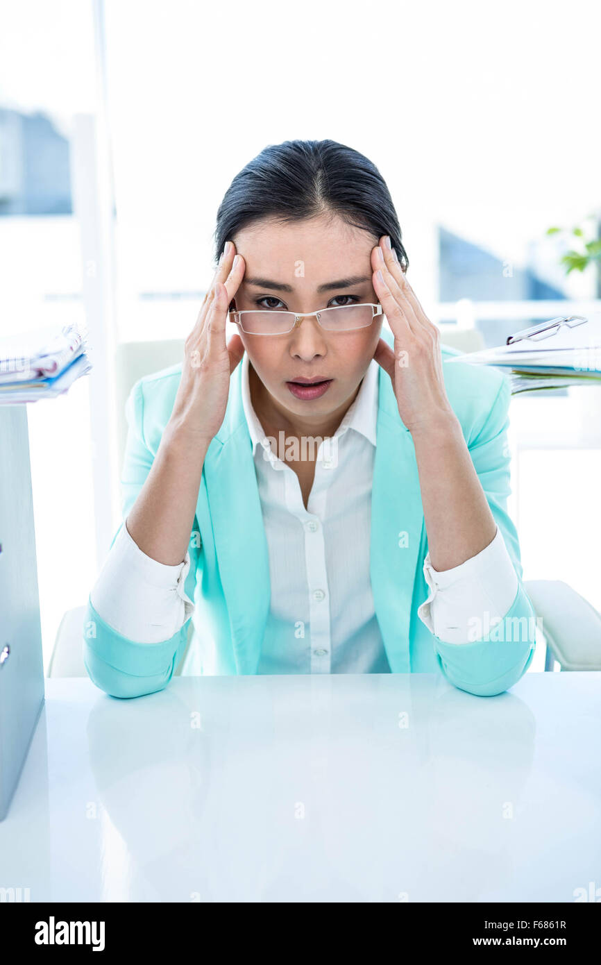 Stressed out business woman Stock Photo - Alamy