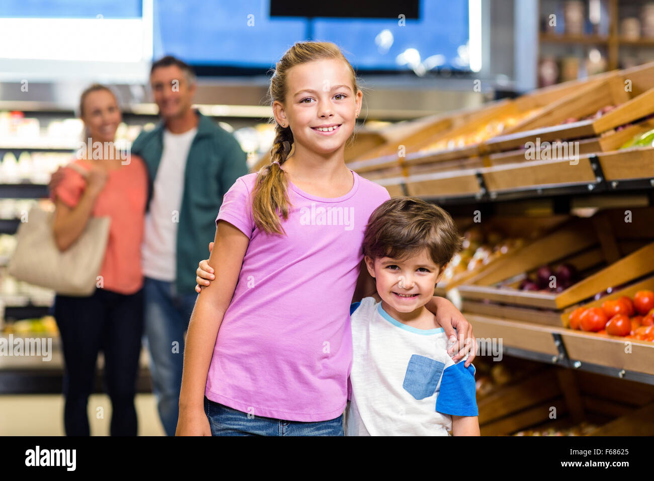 Young family doing some shopping Stock Photo - Alamy