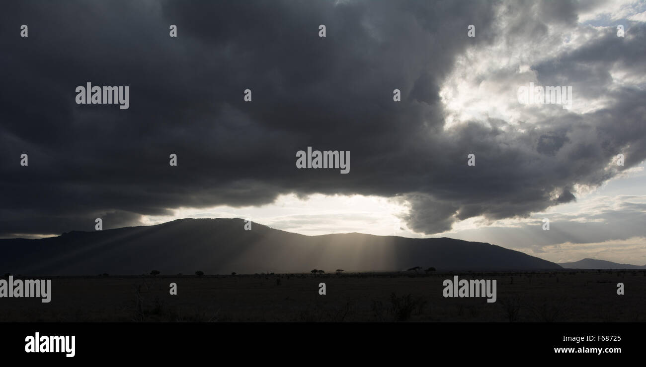 Light shines through the dark clouds in Kenya Africa Stock Photo - Alamy