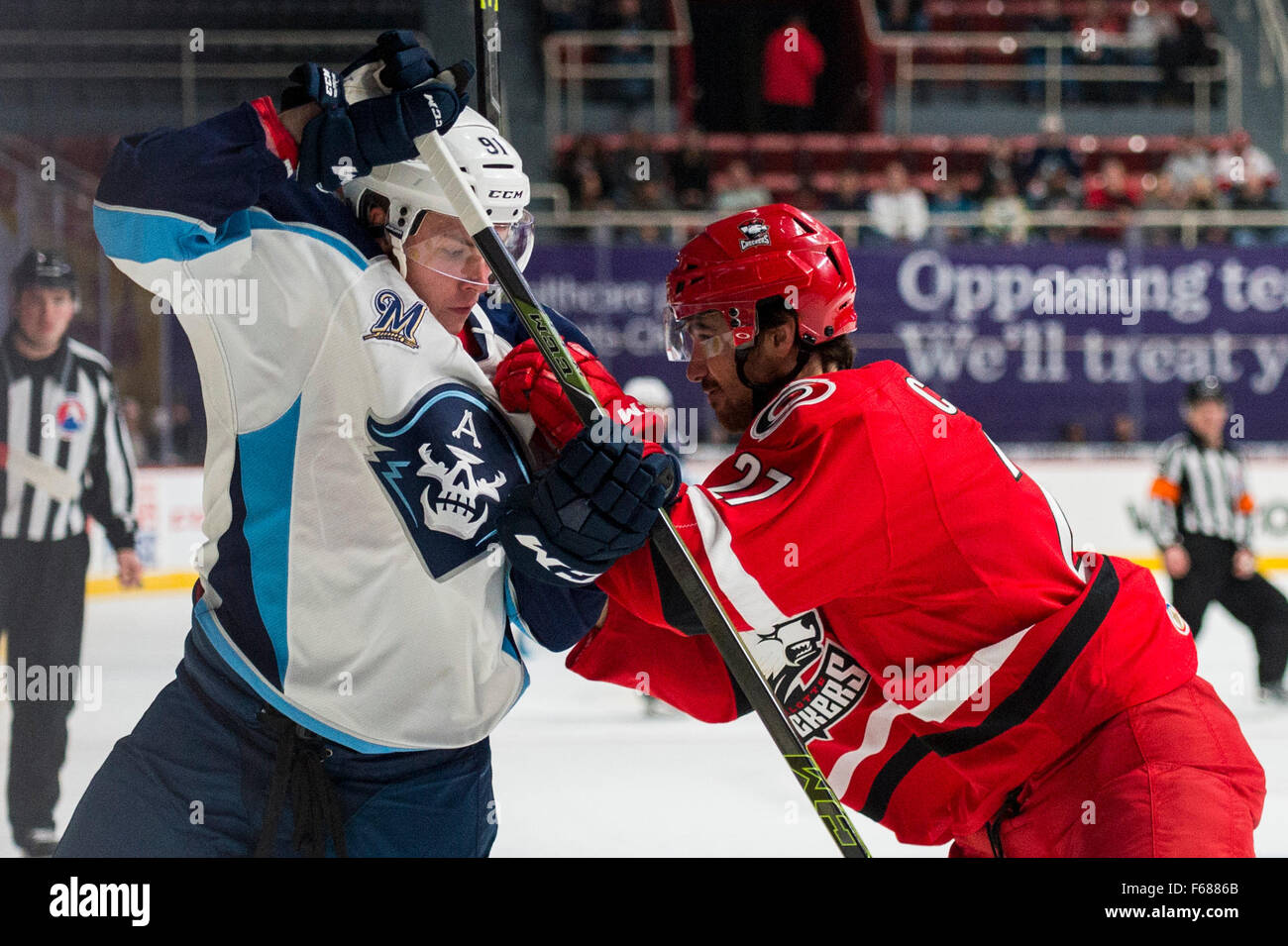 Charlotte Checkers Defenseman Jake Chelios (27) pushes Milwaukee ...