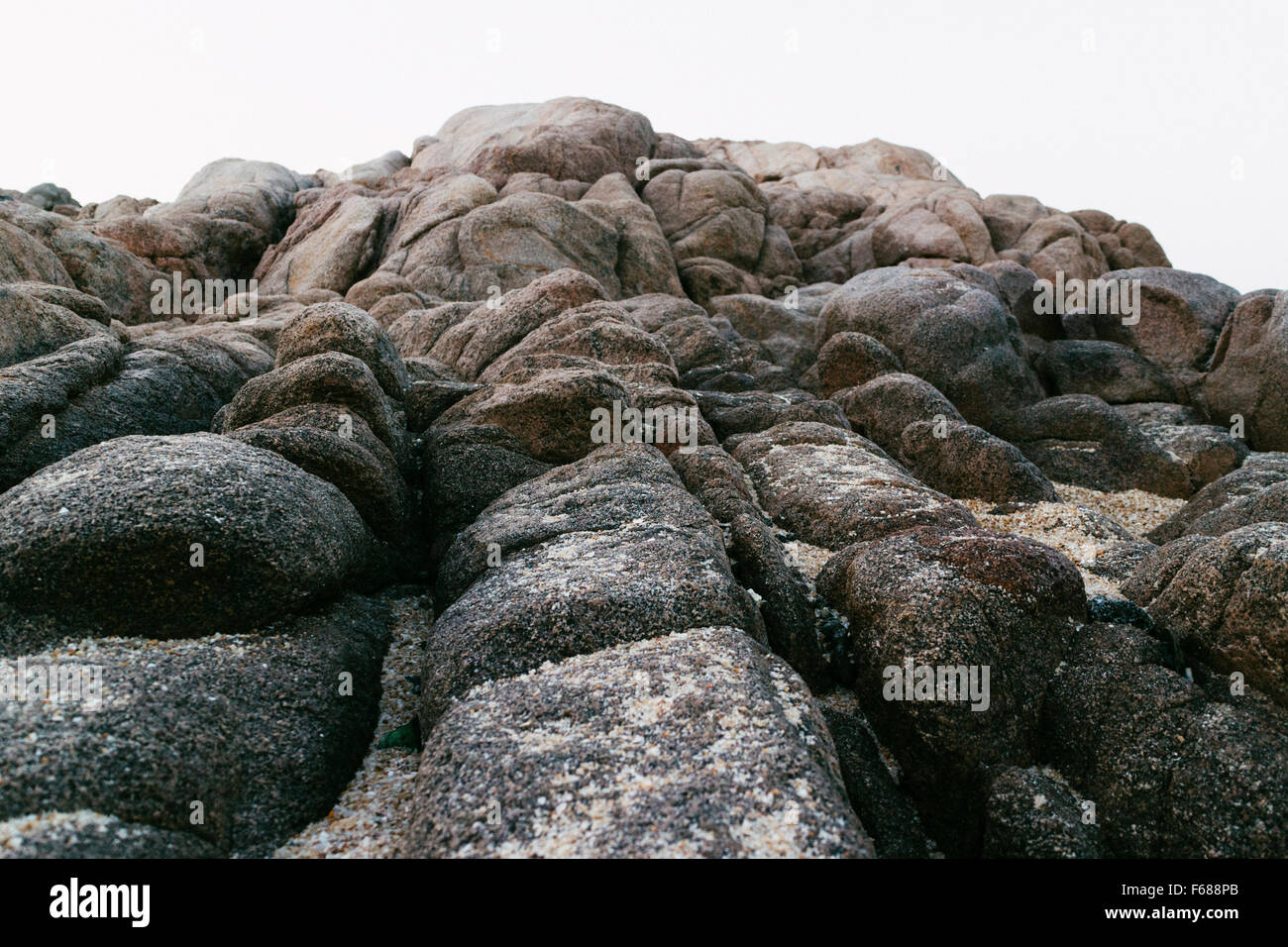 Close up of a huge rock on the sea beach Stock Photo - Alamy