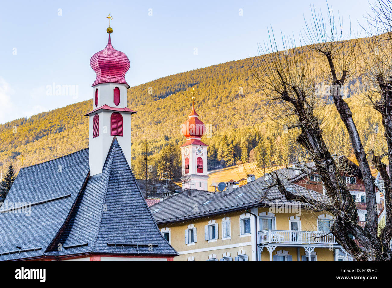 The red steeple and roofs of a people friendly alpine town in the ...