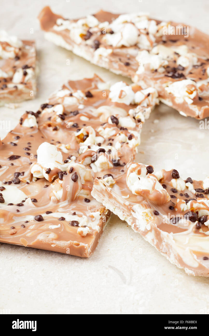 Homemade chocolate bar with milk and white chocolate, popcorn and ...