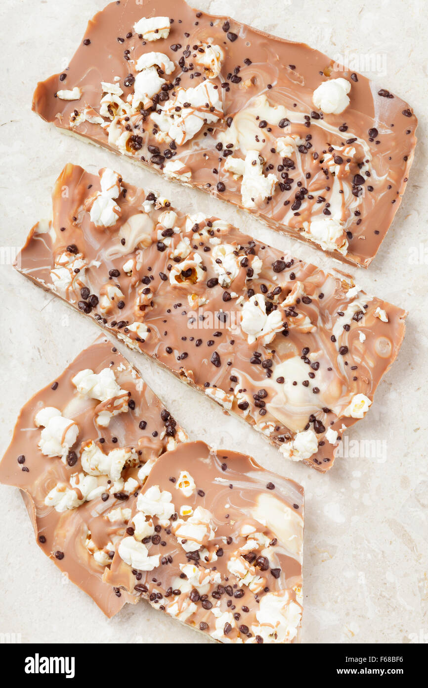 Homemade chocolate bar with milk and white chocolate, popcorn and ...