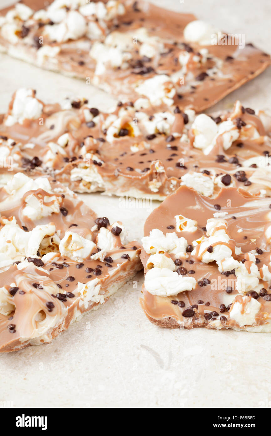 Homemade chocolate bar with milk and white chocolate, popcorn and ...