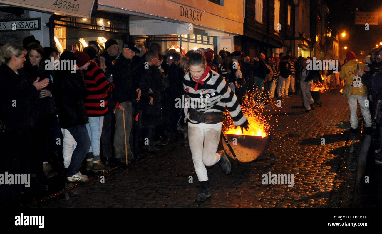 Ladies race with flaming tar barrels at the Lewes Bonfire celebrations ...