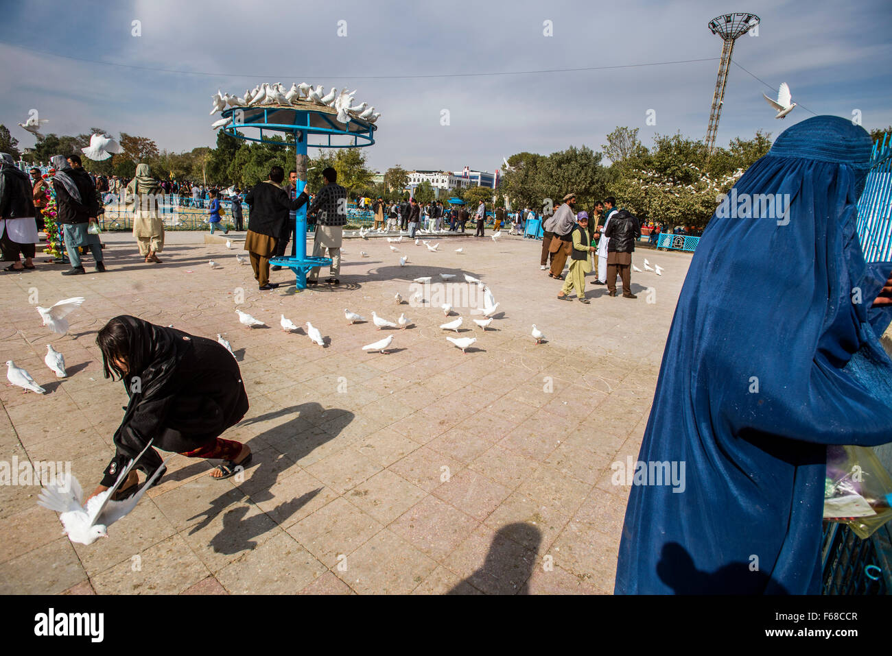 Park with white pigeons around the Shrine of Ali in Mazar-i Sharif ...