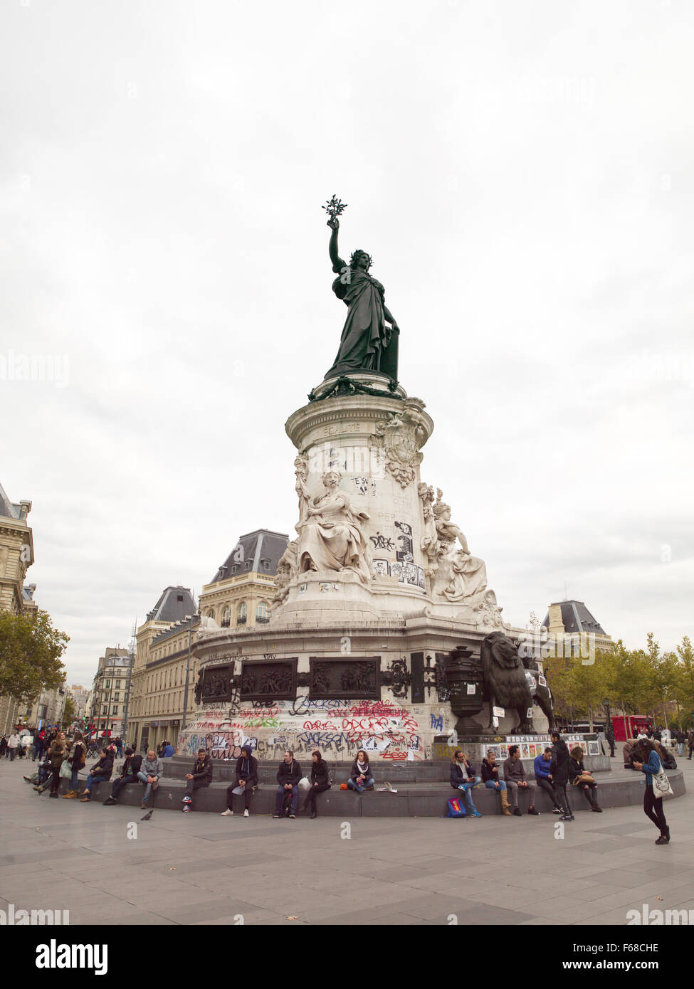 Republic square, Paris, France: People waiting and sitting quietly at ...