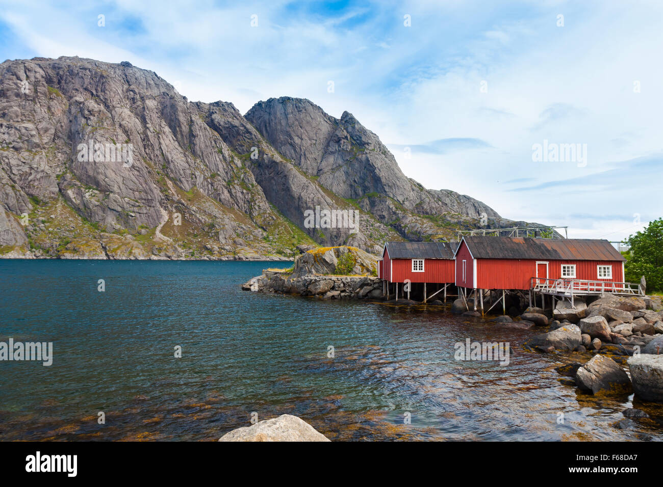 Typical red rorbu fishing hut in town of Svolvaer on Lofoten islands in ...