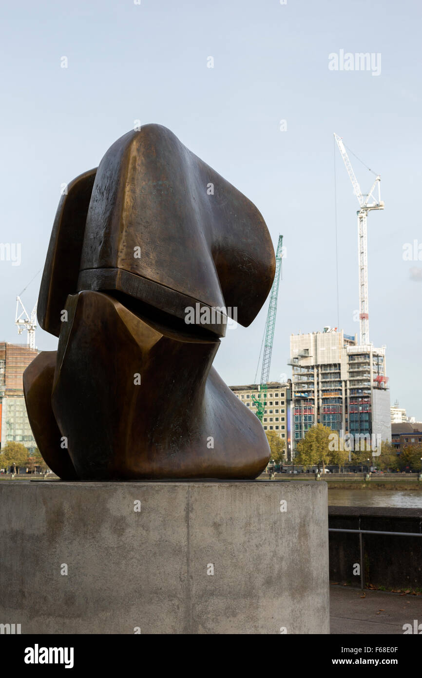 Riverside sculpture with buildings under construction in the background ...
