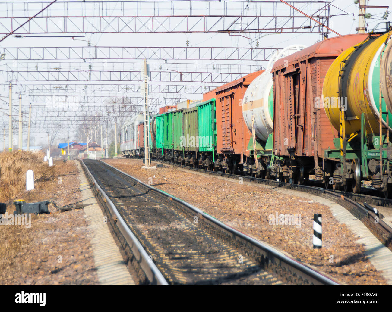 The railroad and the passing train on the railway tanks Stock Photo - Alamy
