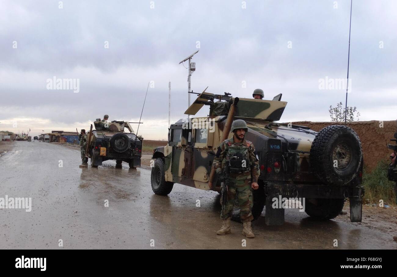 Helmand. 14th Nov, 2015. Afghan army soldiers stand guard near a ...