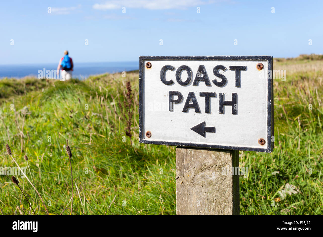 An old coast path sign on the Cornish cliffs near Tintagel, UK ...