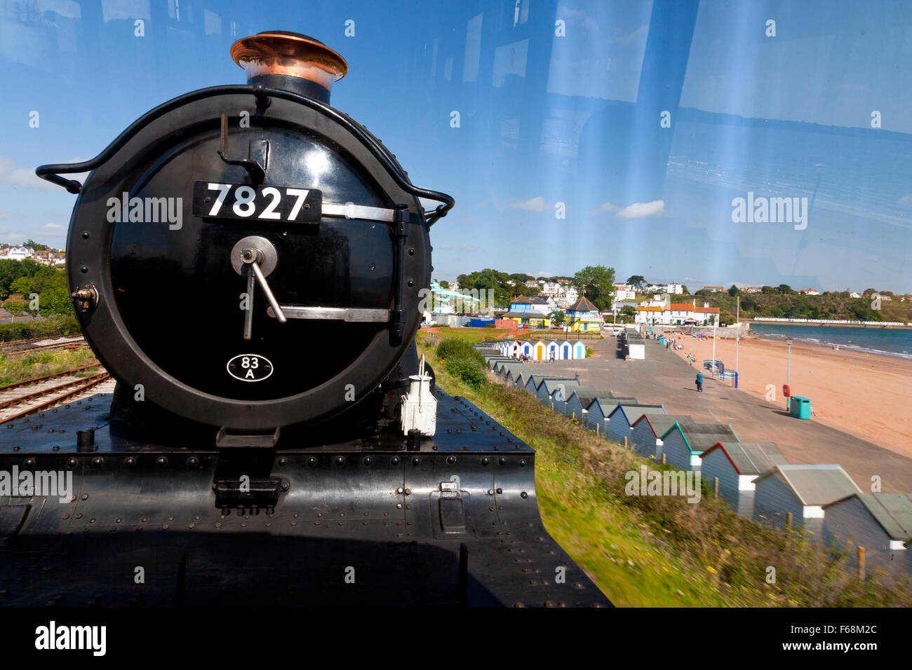 Locomotive 7827 'Lydham Manor' pulling its train past Goodrington Sands ...