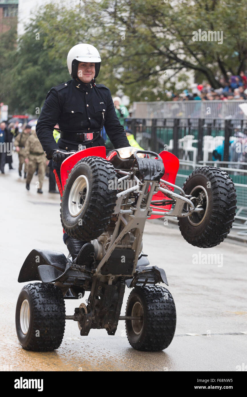 London, UK. 14 November 2015. A man performs stunts on a quad bike. The ...