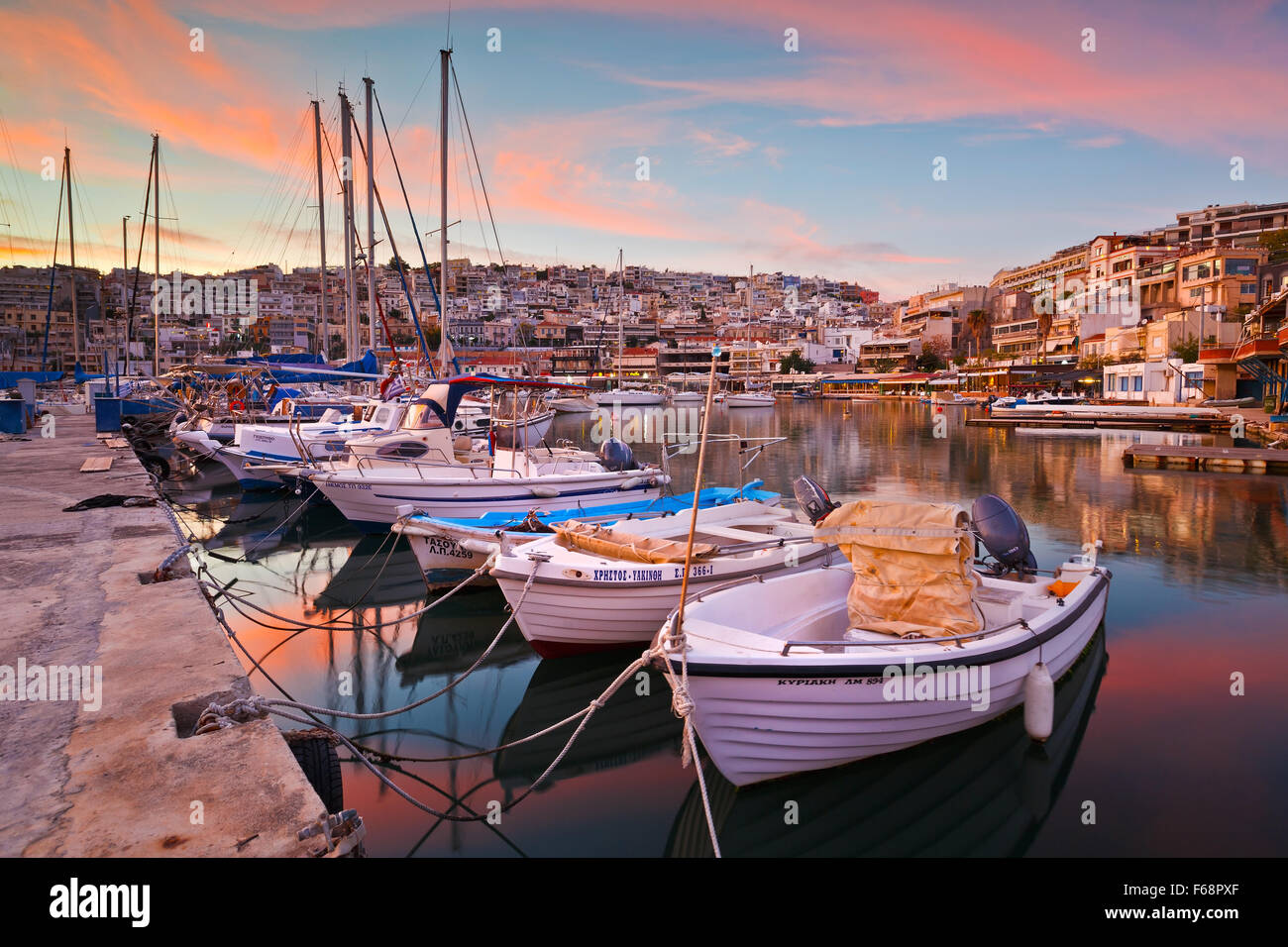 Boats mooring at a pier in Mikrolimano marina in Athens, Greece Stock ...
