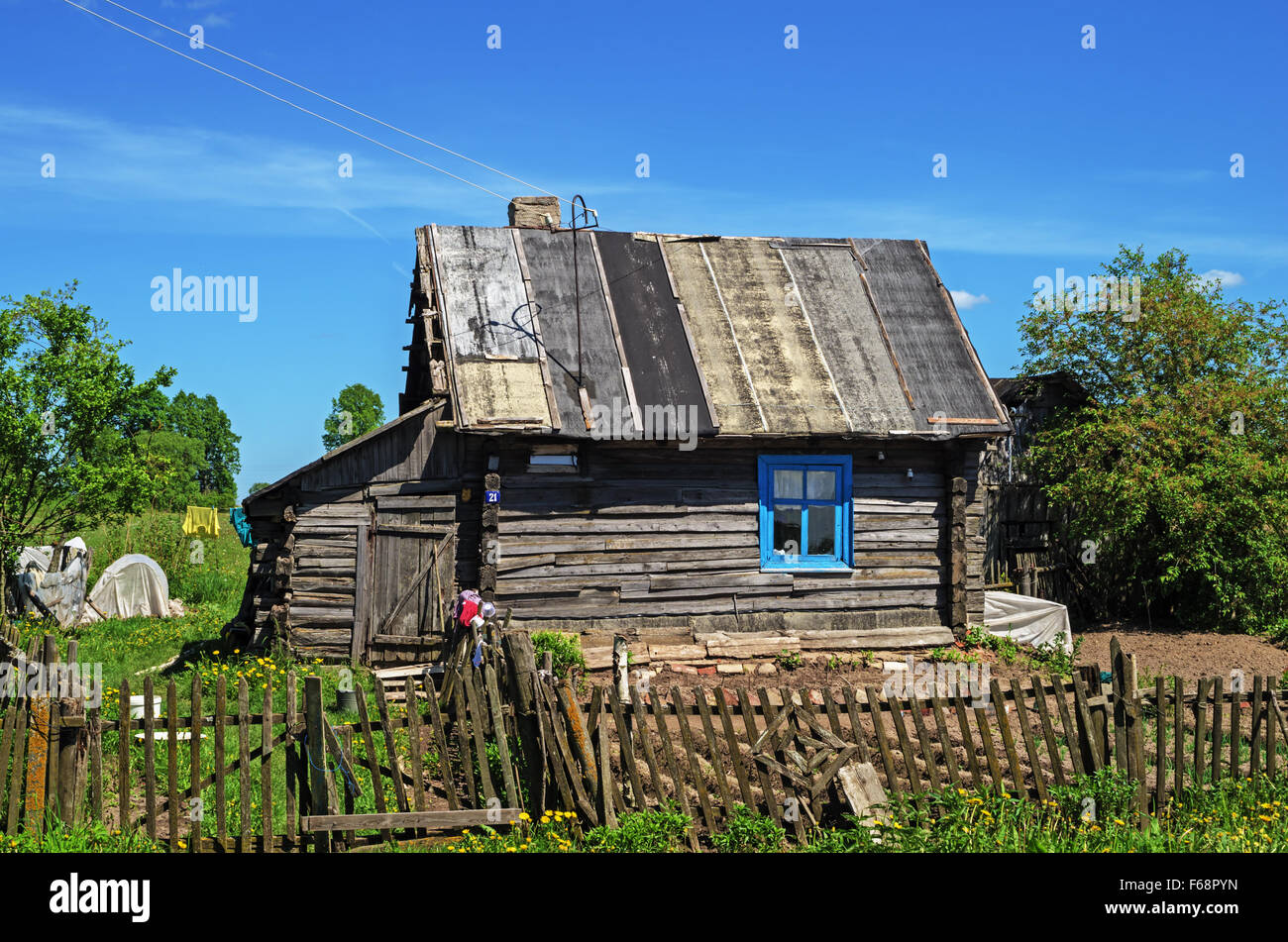 Village landscape.Old wooden house in village Stock Photo - Alamy