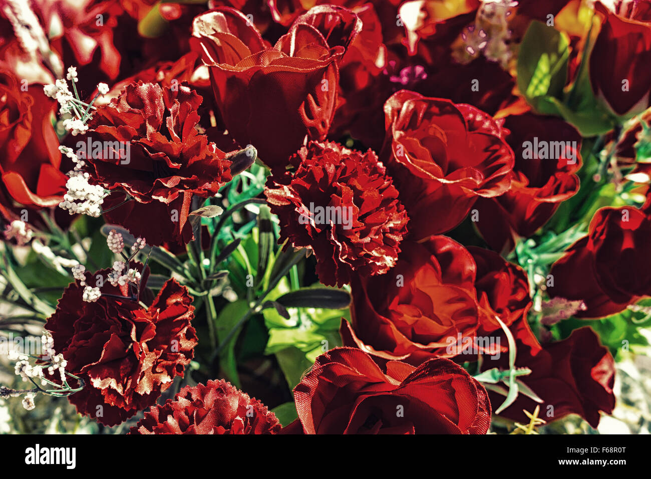 fake laminated paper flowers in a cemetery Stock Photo - Alamy