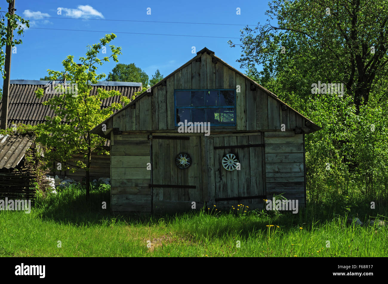 Village landscape.Wooden garage for the car in the village Stock Photo ...