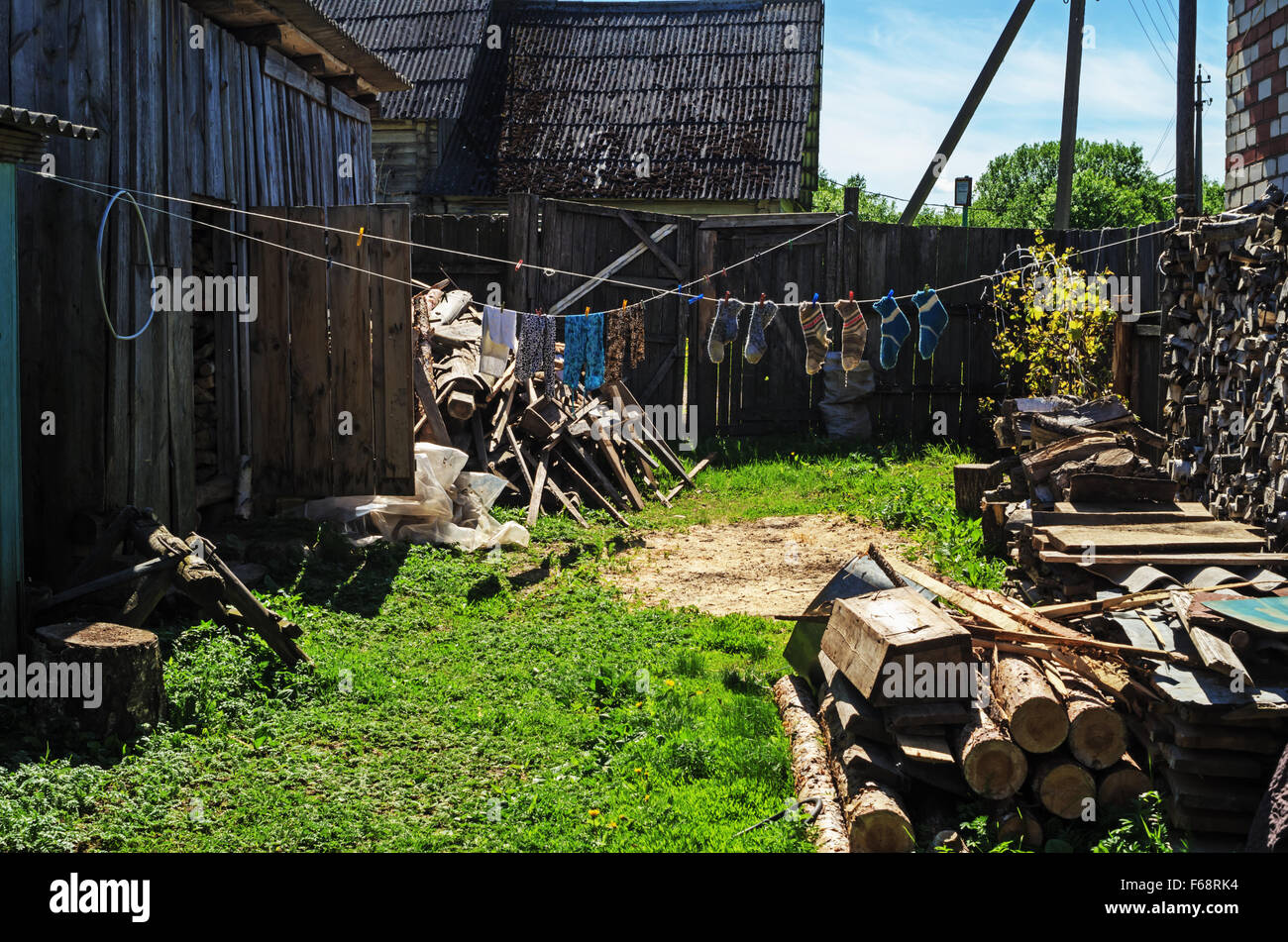 Spring in village. Sunny rural yard Stock Photo - Alamy