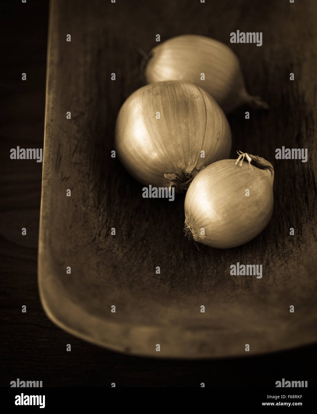 Group of three onions in a bowl Stock Photo - Alamy