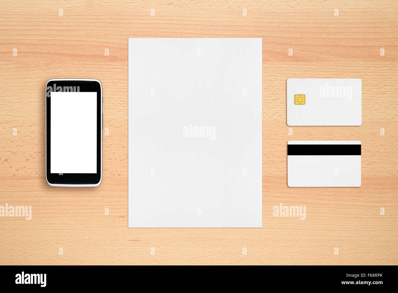 Credit card, paper sheet and cell phone on office table Stock Photo - Alamy